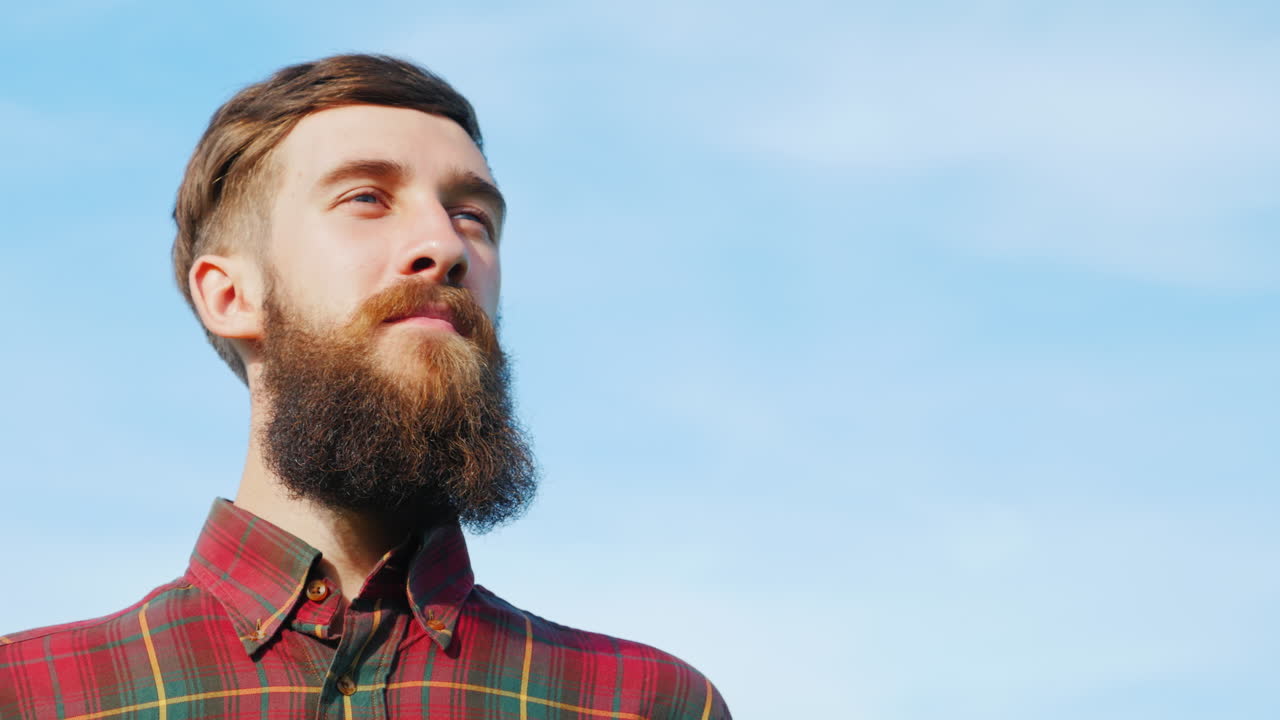 Premium stock video - Portrait of a young man with a beard