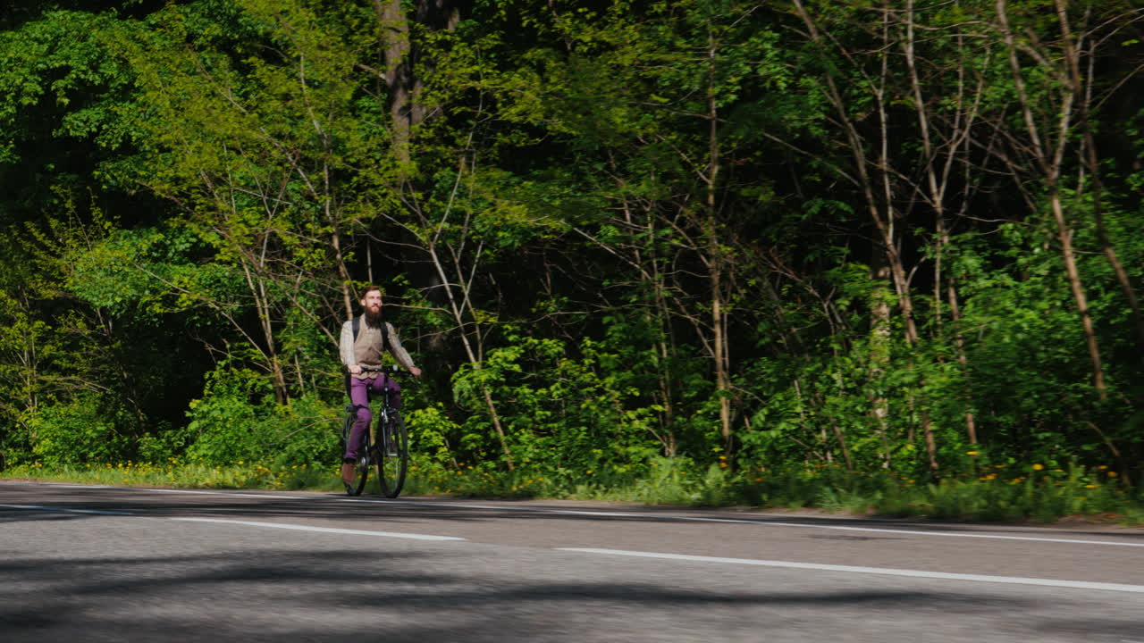 Premium stock video - Low angle shot: man riding a bicycle