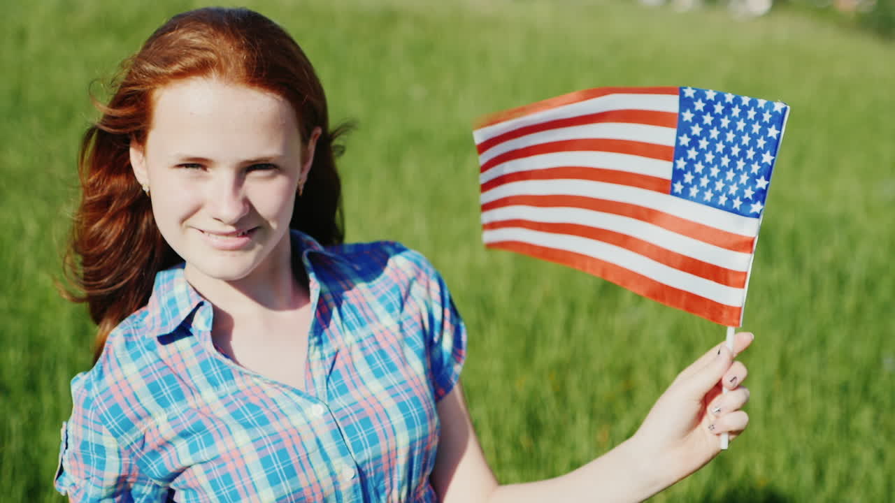 Premium stock video - Attractive red-haired teenage girl with the ...