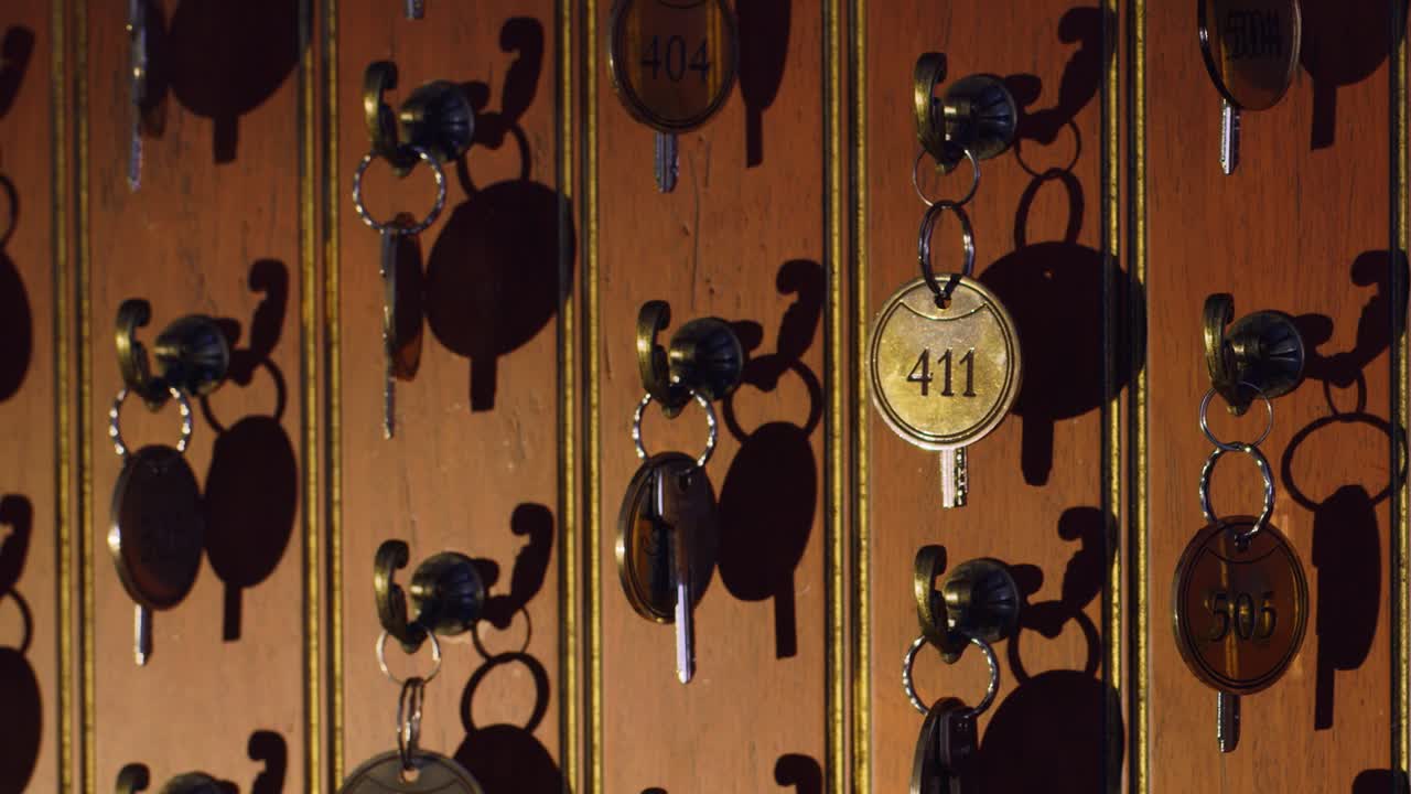 Premium stock video - Lots of keys at the reception desk in the hotel