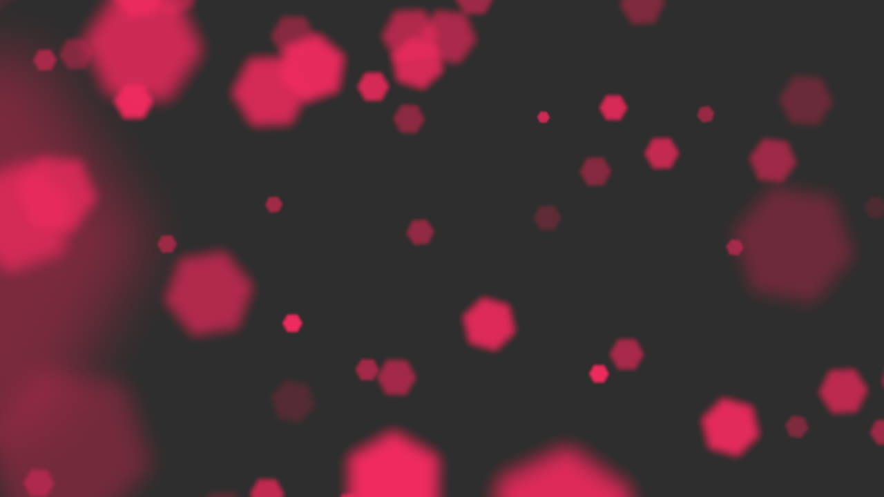 Premium stock video - Red glitters and particles on black background