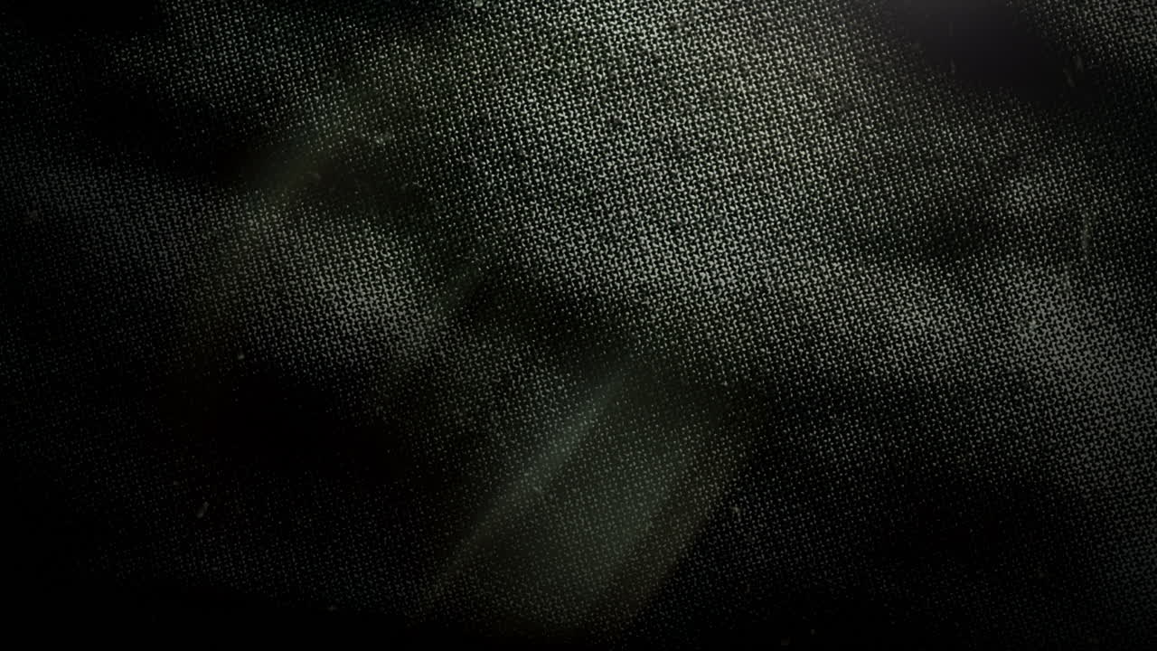 Premium stock video - Fly particles and light effect on grunge texture